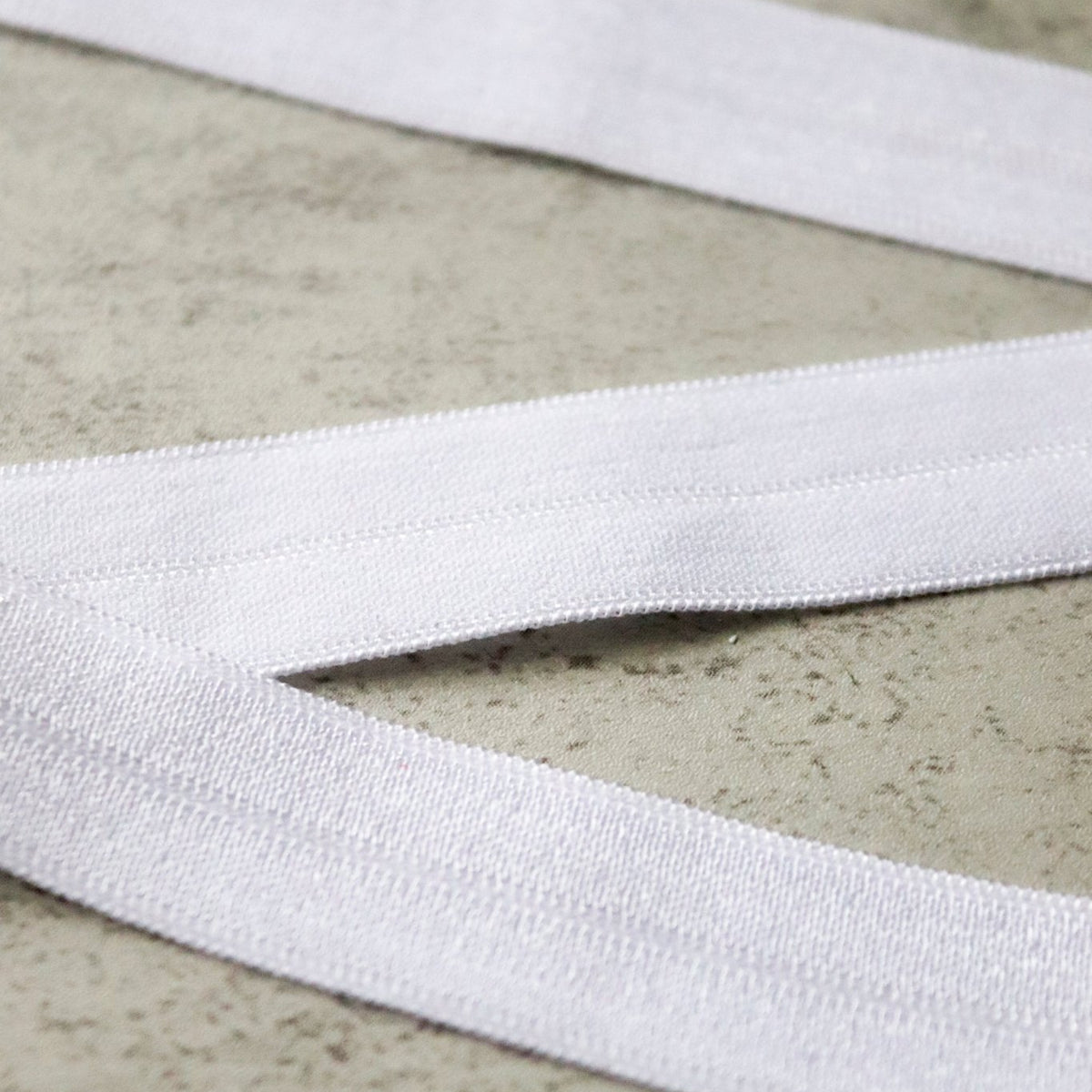 5/8" White, Fold Over Elastic. SOLD PER PACKAGE OF 3 YARDS. – Boho Fabrics
